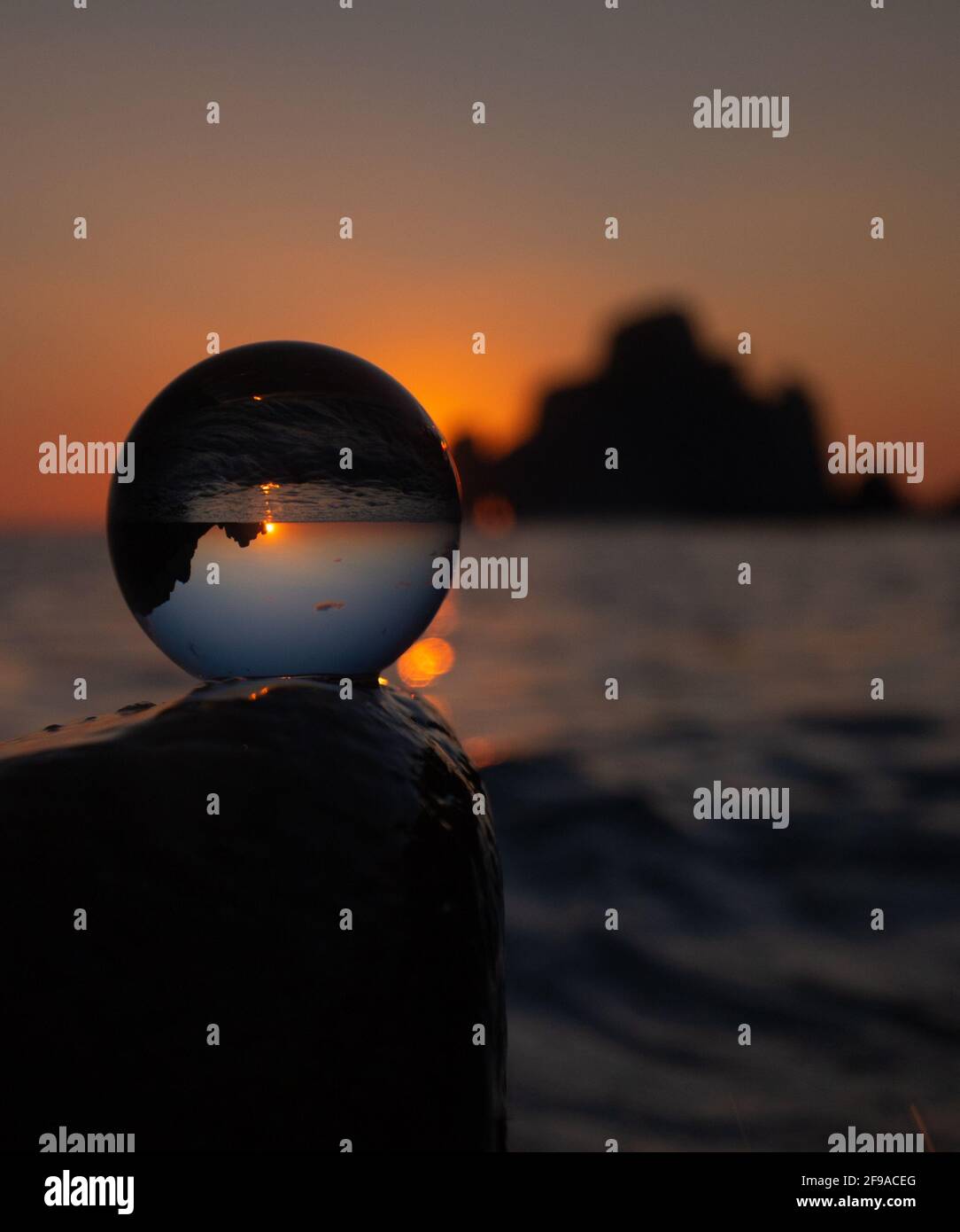 super sunset in the south of sardinia in front of the stack of sugar ...