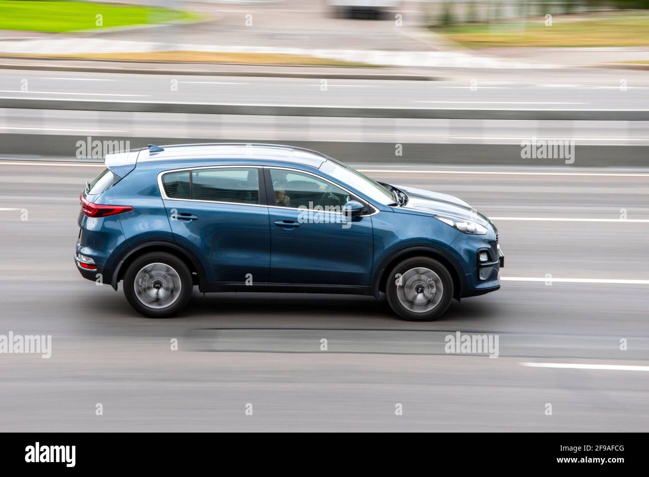 Ukraine, Kyiv - 29 September 2020: Blue Kia Sportage car moving on the ...