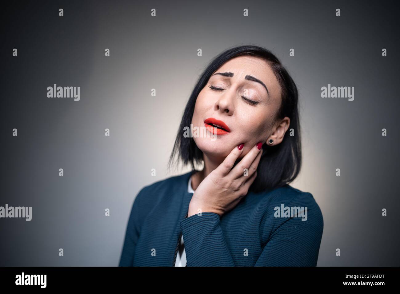 Female standing thinking hi-res stock photography and images - Alamy