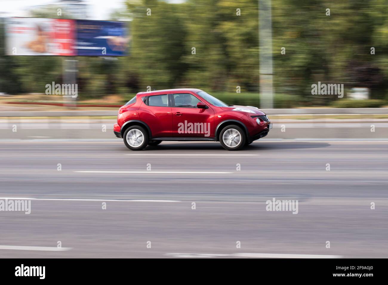 Ukraine, Kyiv - 24 September 2020: Red car moving on the street Stock ...