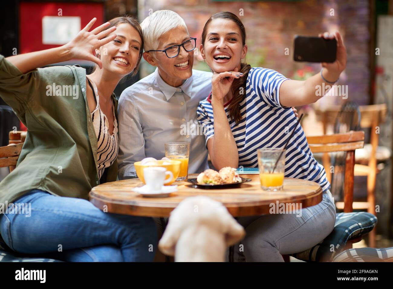 Group of women taking a selfie in a bar hi-res stock photography and ...