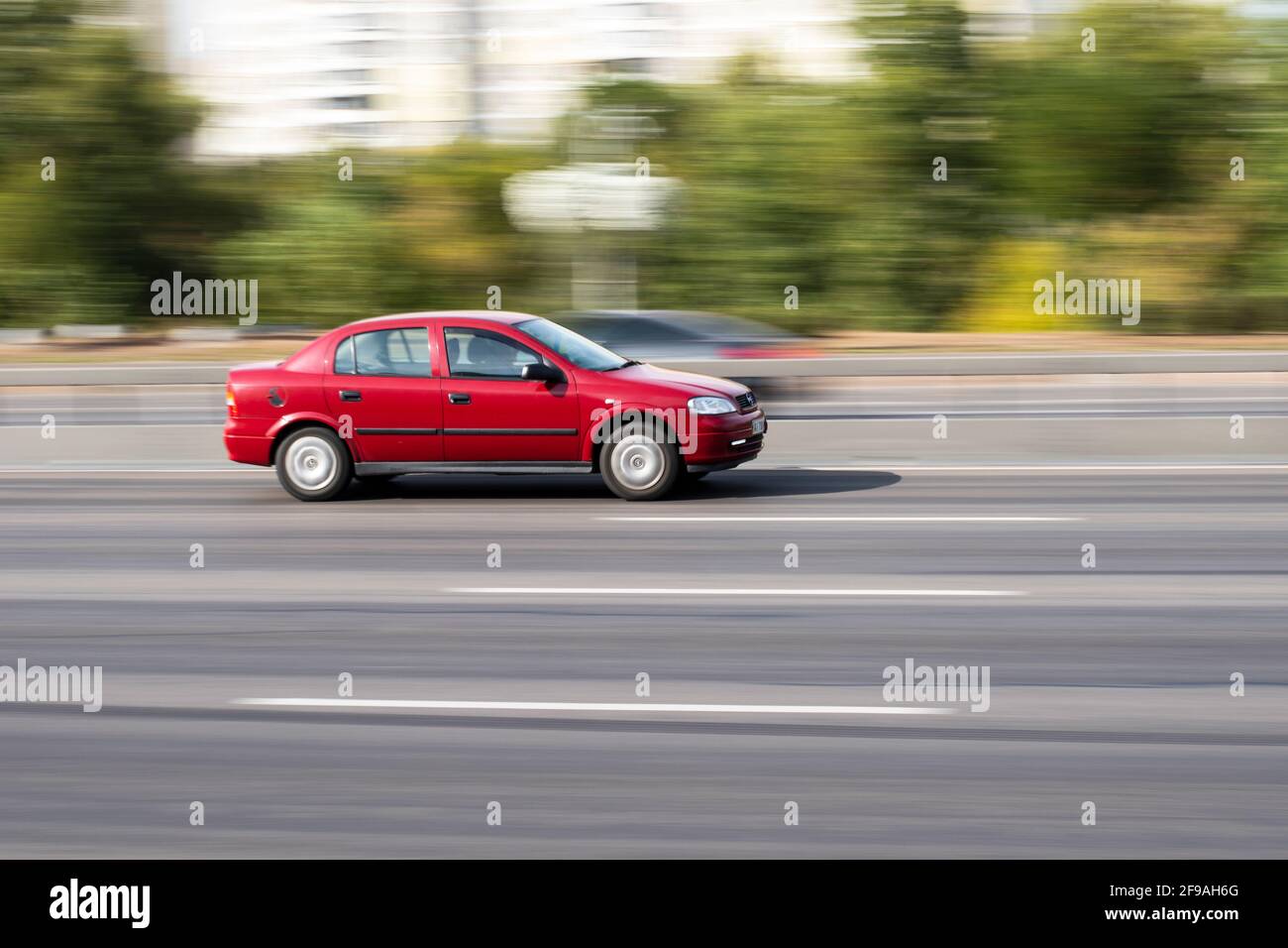 Ukraine, Kyiv - 24 September 2020: Red car moving on the street Stock ...