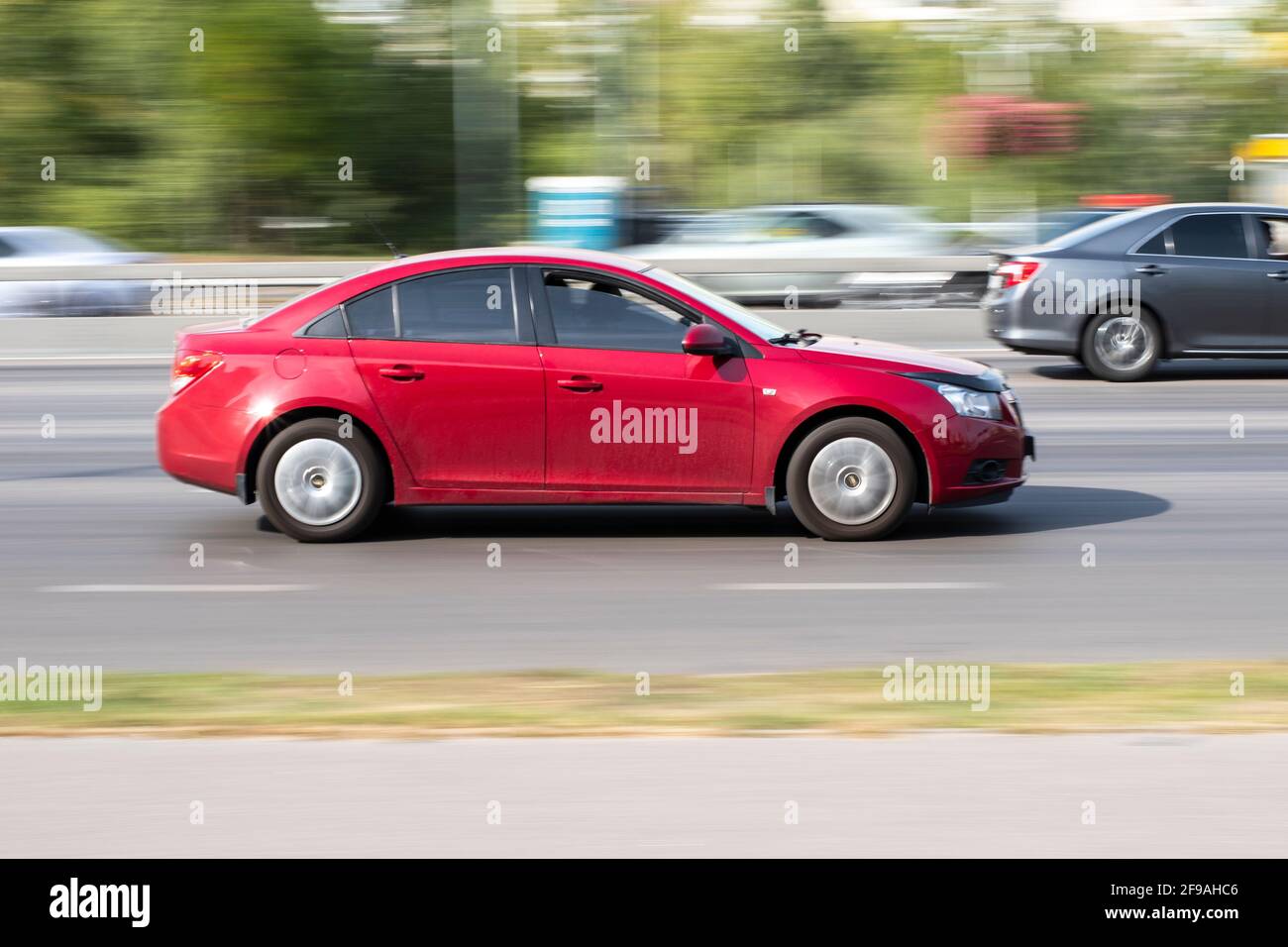 Ukraine, Kyiv - 24 September 2020: Red car moving on the street Stock ...