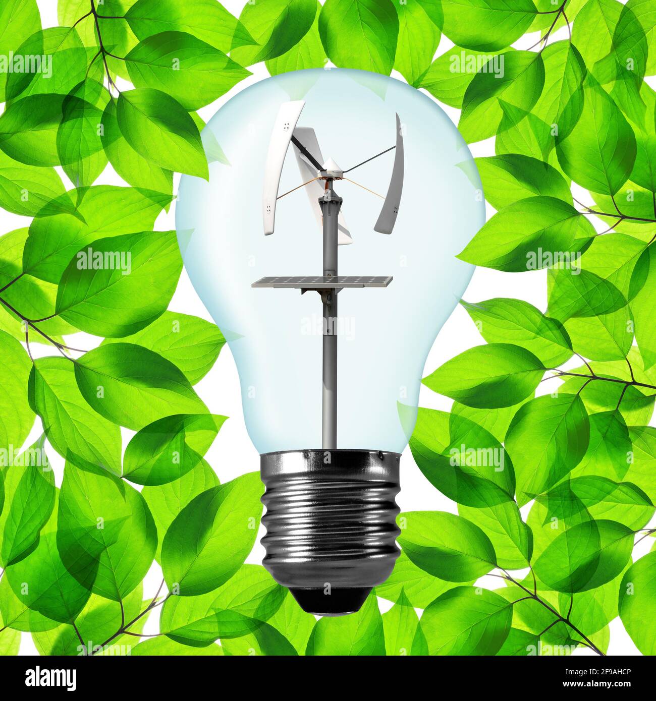 Eco light bulb with wind turbine. Clean energy concept Stock Photo - Alamy