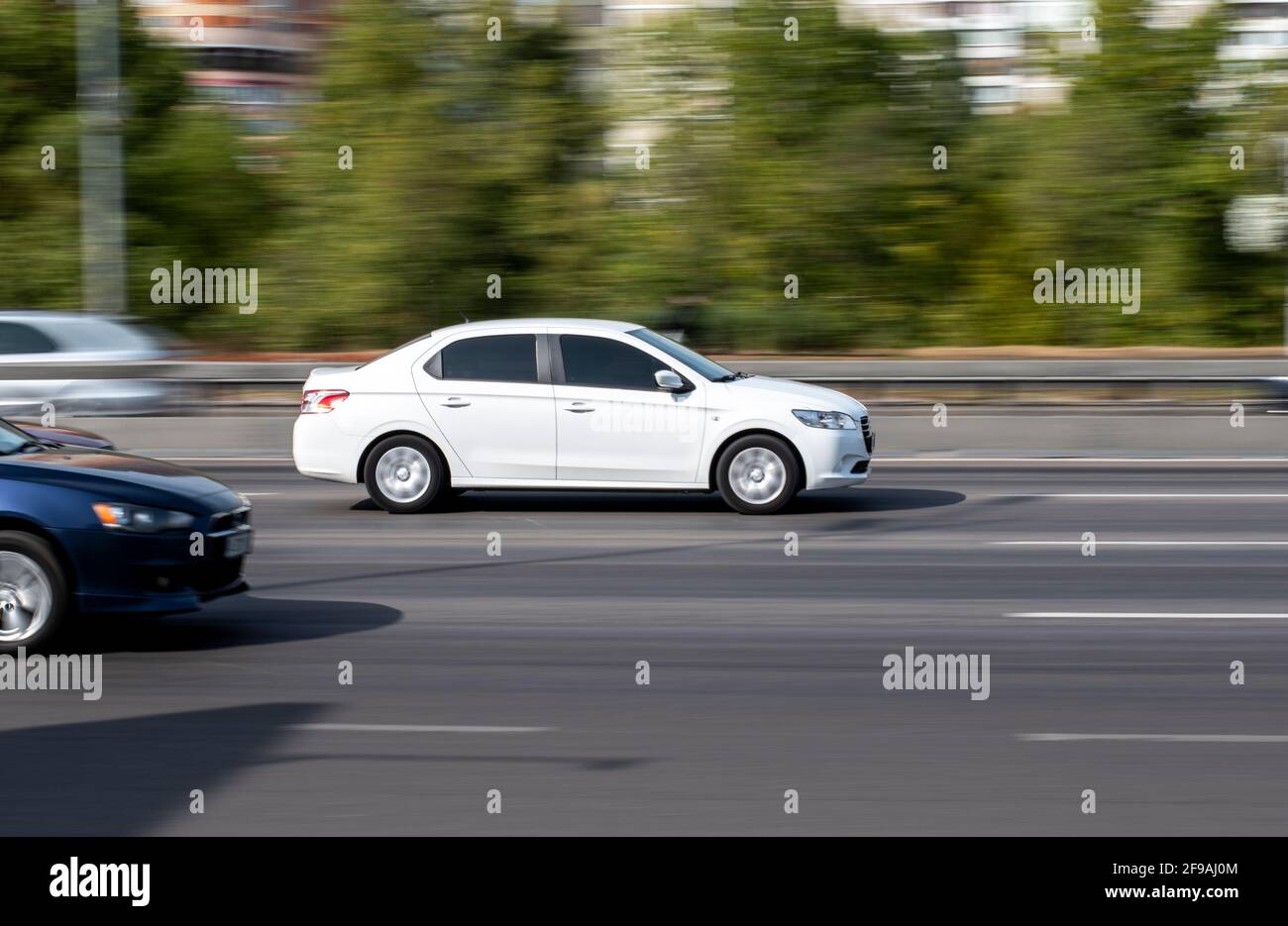 Ukraine, Kyiv - 24 September 2020: White car moving on the street Stock ...