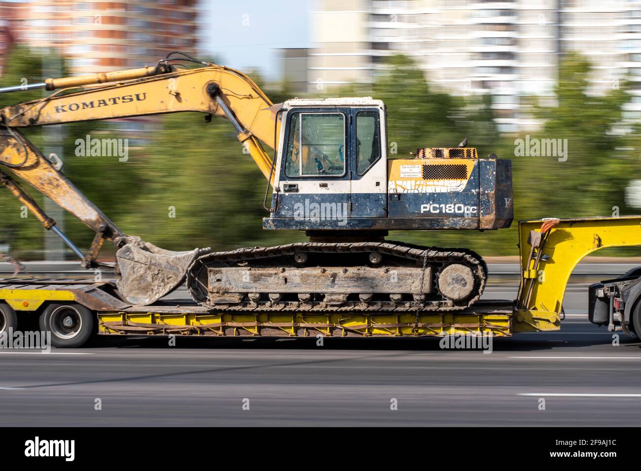 Ukraine, Kyiv - 24 September 2020: Excavator moving on the street Stock ...