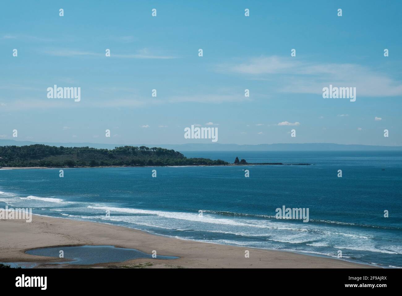 The blue and beautiful color of the Sawarna beach in Banten, Indonesia ...