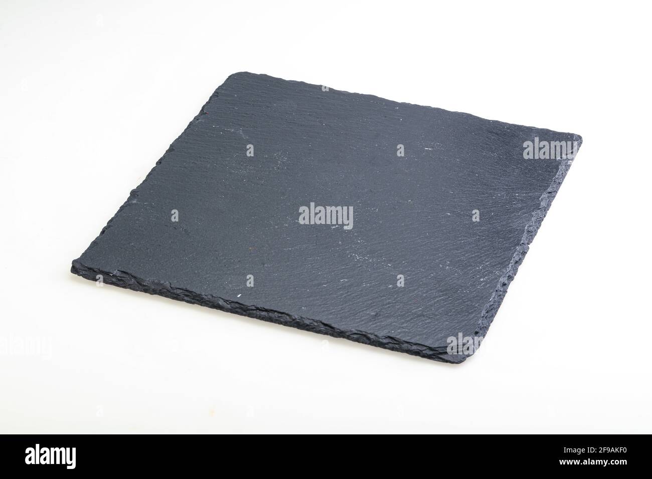 Black stone board isolated on white background Stock Photo - Alamy
