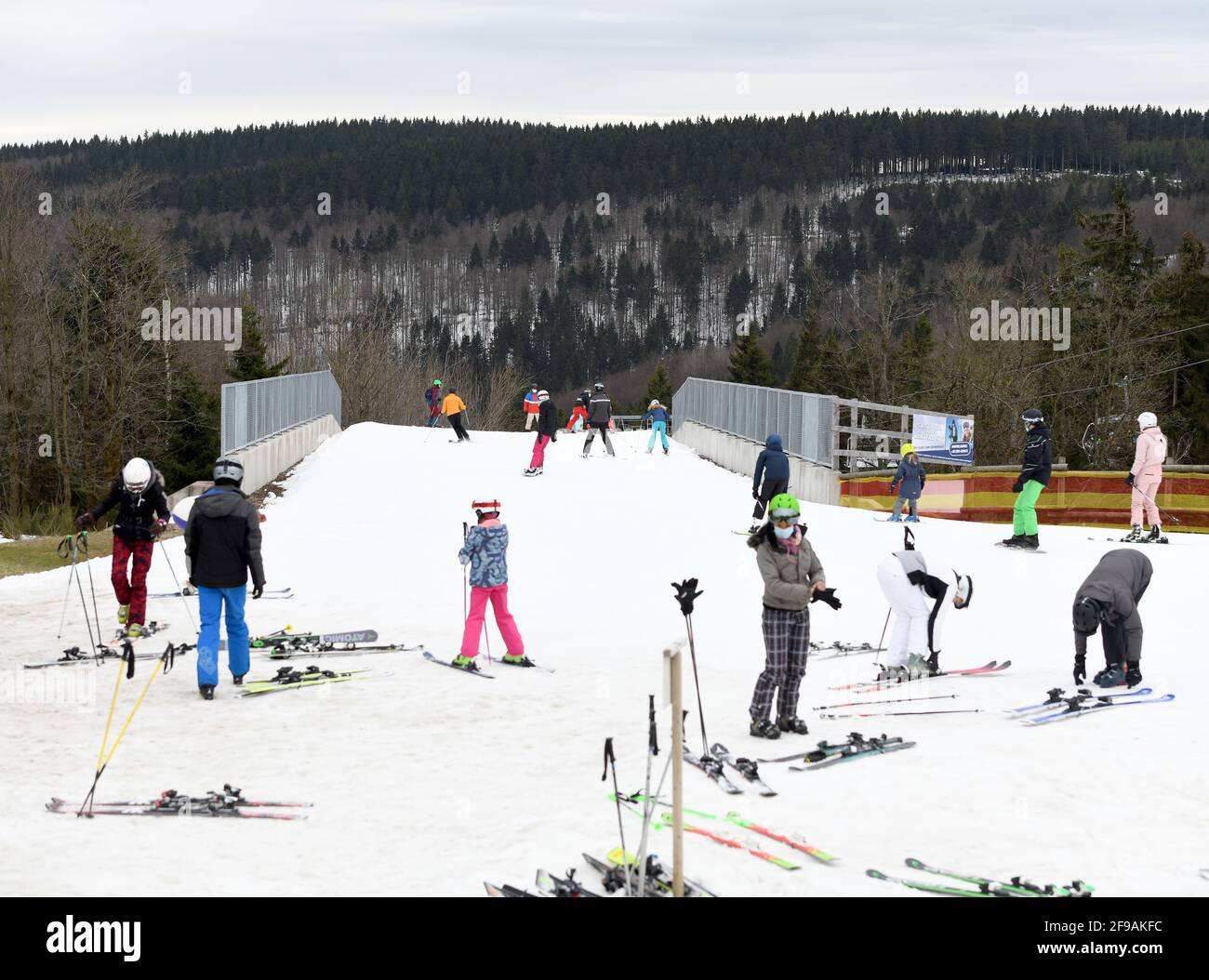 Winterberg, Germany. 17th Apr, 2021. Visitors with skis ski down a ...