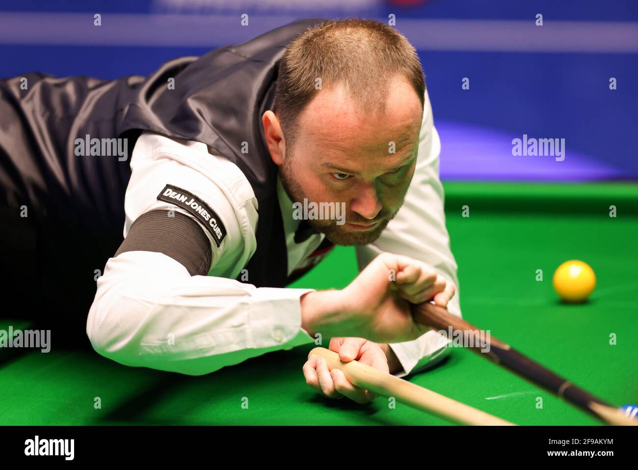 Mark Joyce plays a shot during the Betfred World Snooker Championships ...