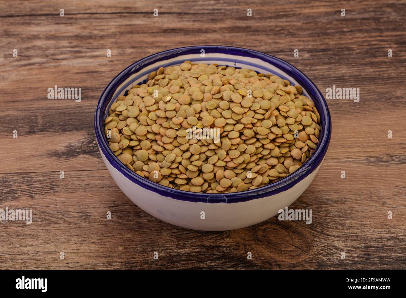 Vegan cuisine - Dry lentil heap isolated Stock Photo - Alamy