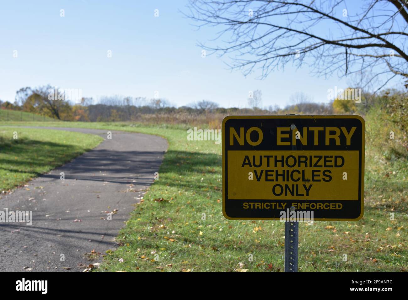 Signboard by the road prohibiting the entry of non-authorized vehicles ...