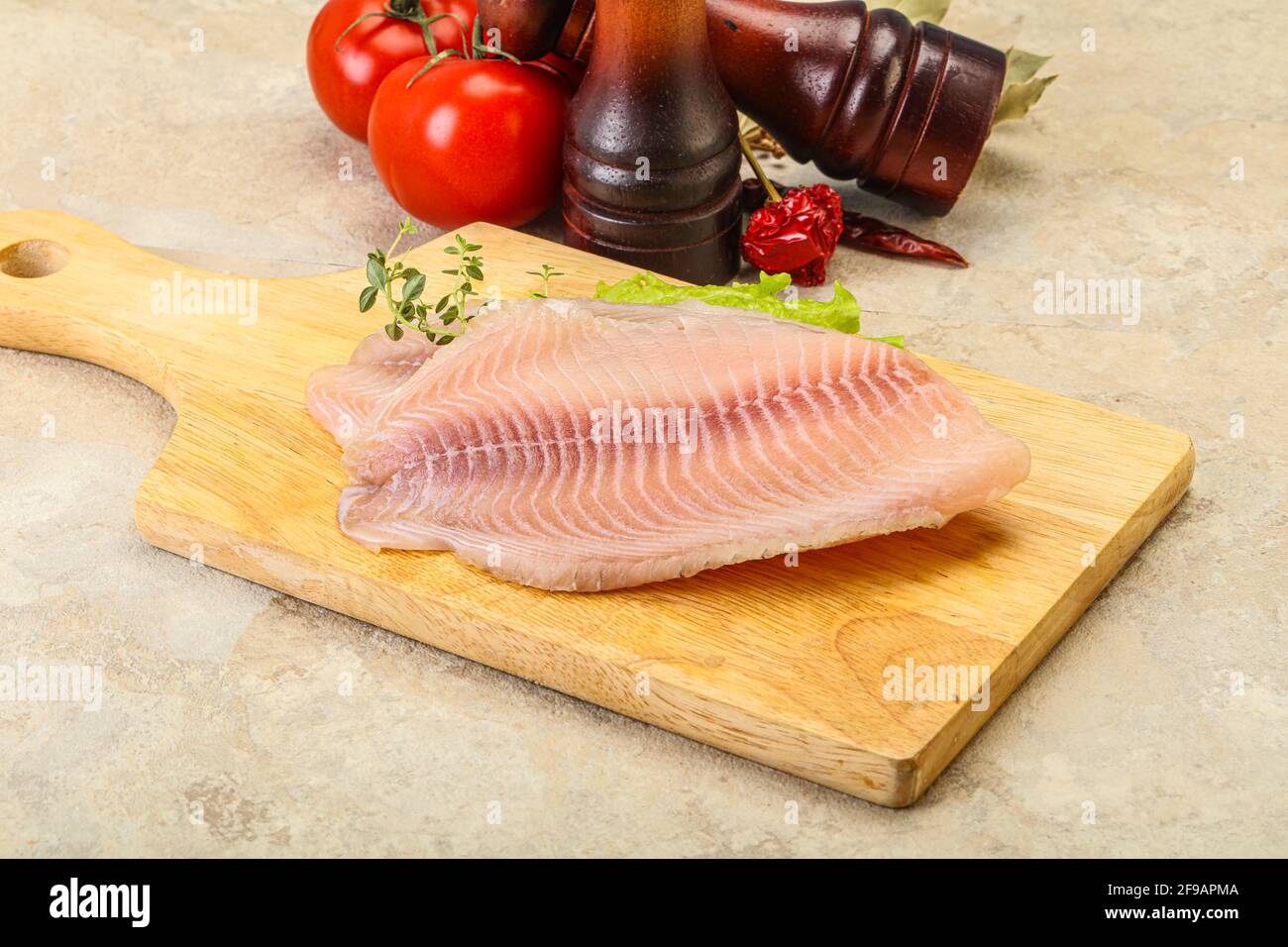 Raw tilapia fish fillet for cooking Stock Photo - Alamy