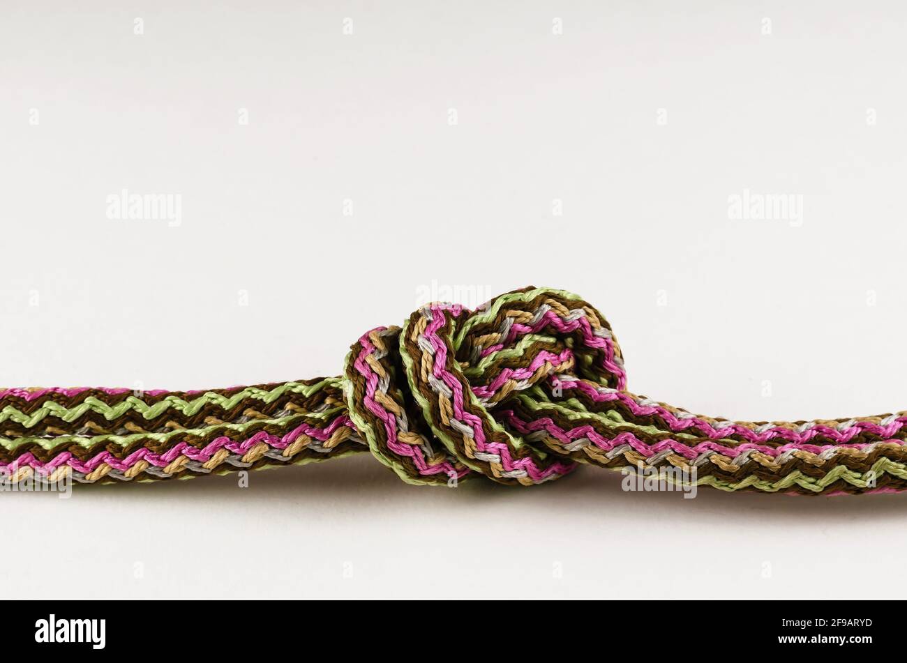 Universal polypropylene rope on a neutral background. Rope with a knot ...