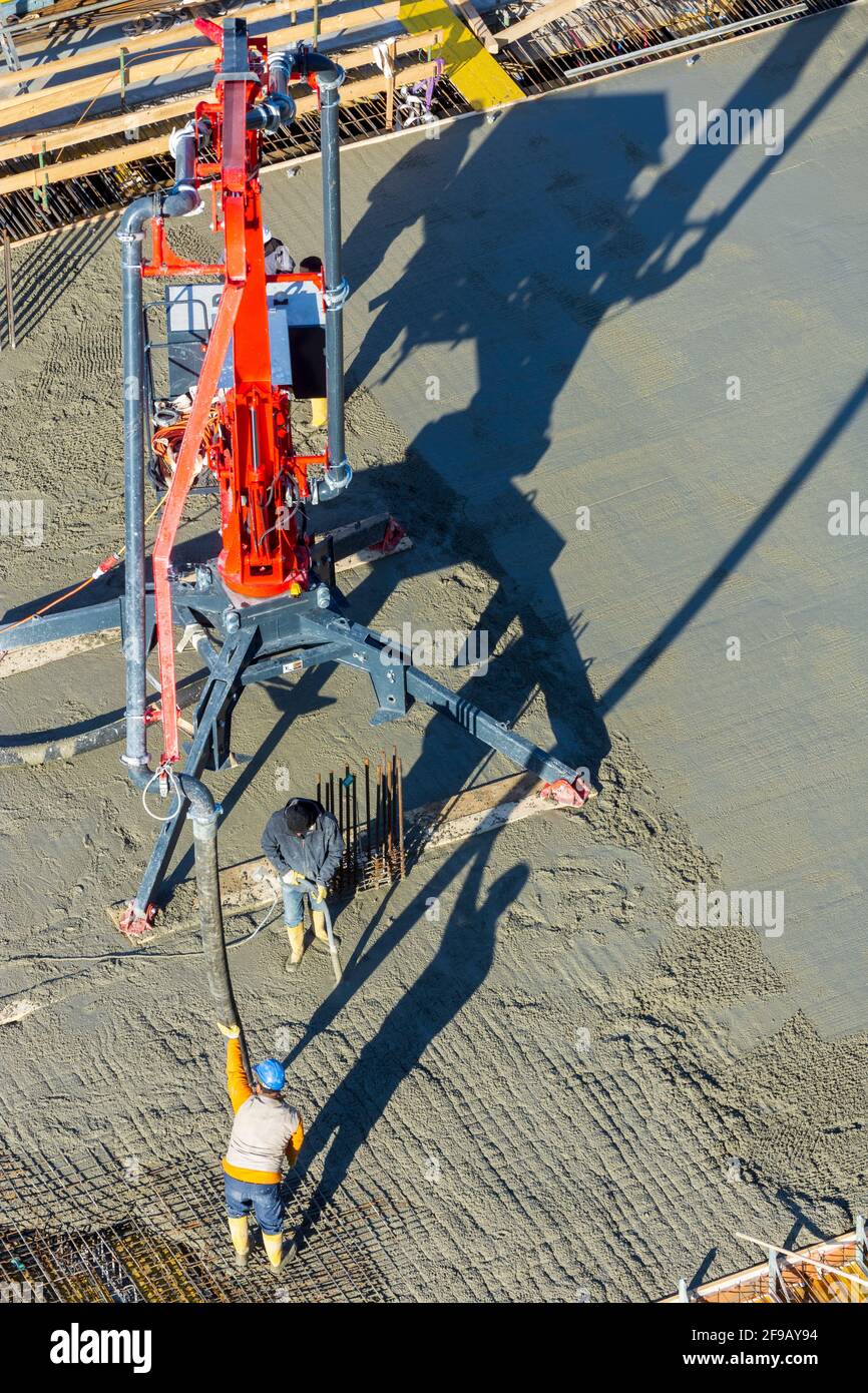 Wien, Vienna: concreting work on construction site, worker in 22 ...