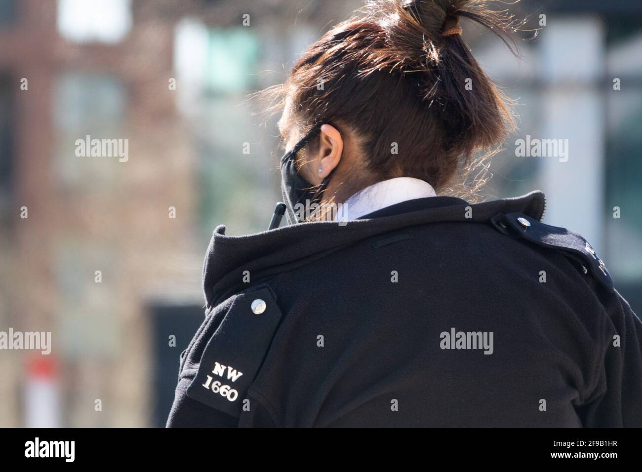 Rear view of a female police officer of the Metropolitan Police Stock ...