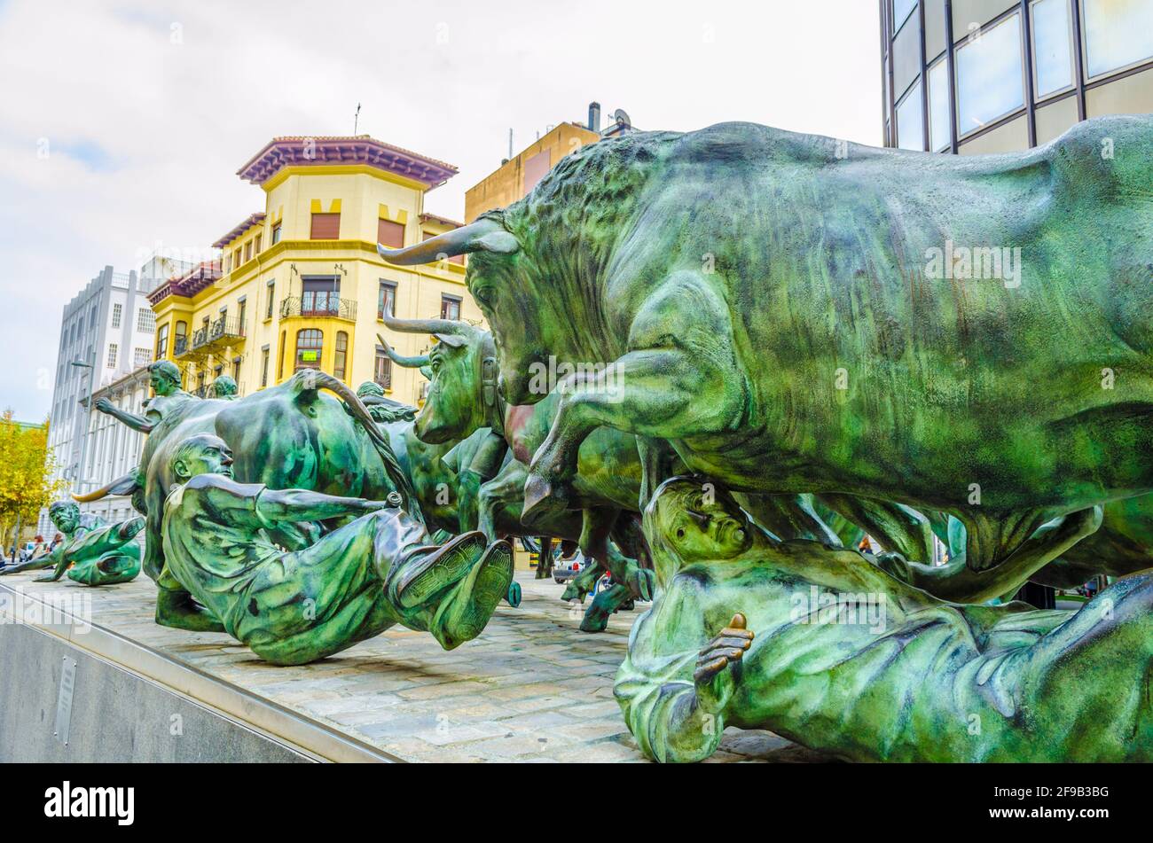 PAMPLONA, SPAIN, OCTOBER 28, 2014: Encierro statue depicting people ...