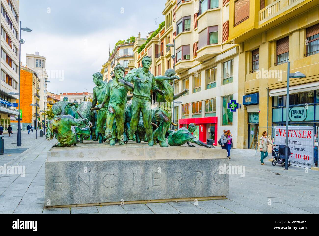 PAMPLONA, SPAIN, OCTOBER 28, 2014: Encierro statue depicting people ...