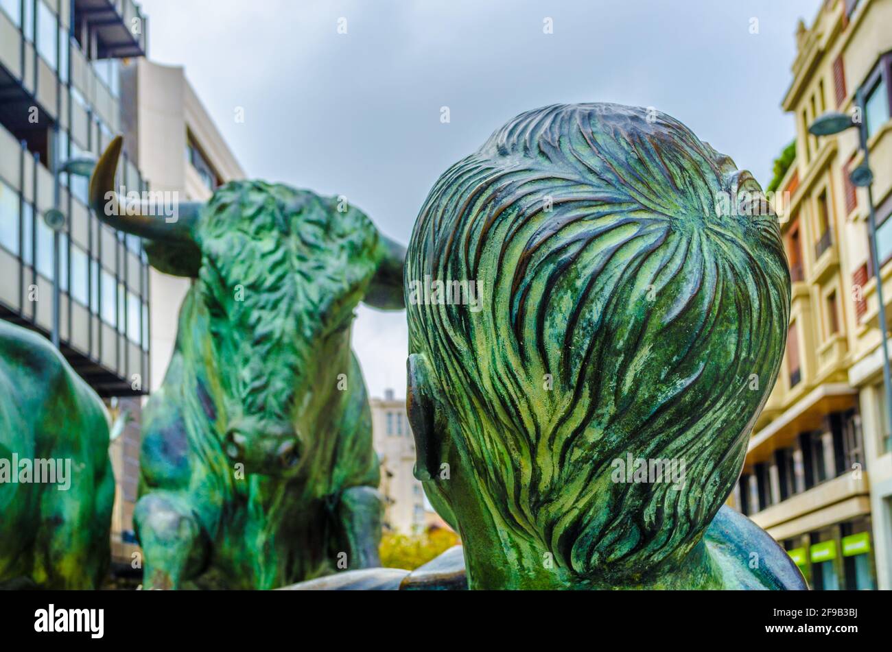 PAMPLONA, SPAIN, OCTOBER 28, 2014: Encierro statue depicting people ...