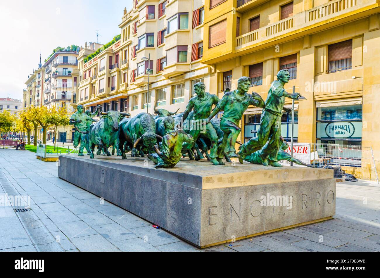 PAMPLONA, SPAIN, OCTOBER 28, 2014: Encierro statue depicting people ...