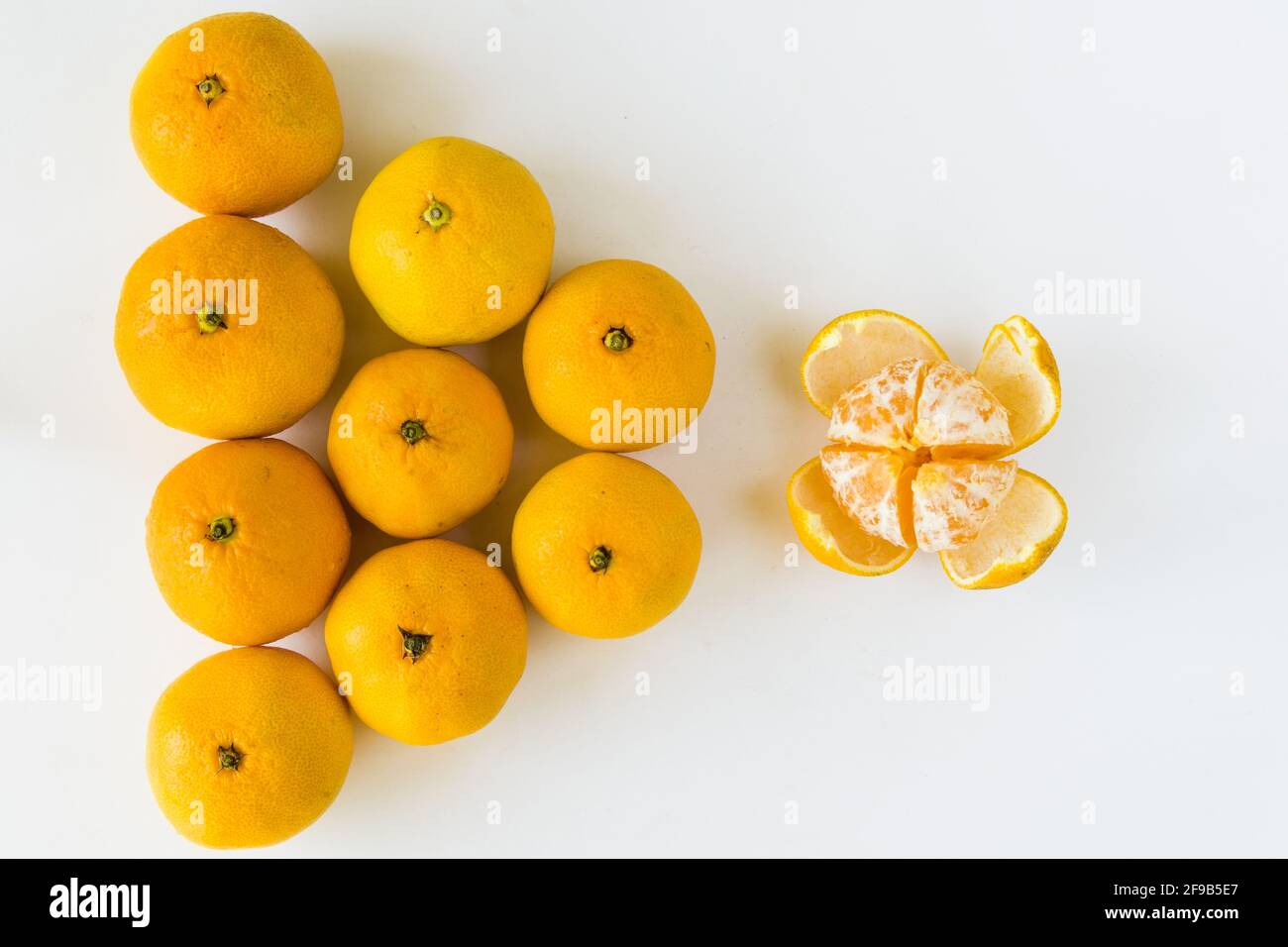 Top view of fresh peeled and whole clementine isolated on a white ...