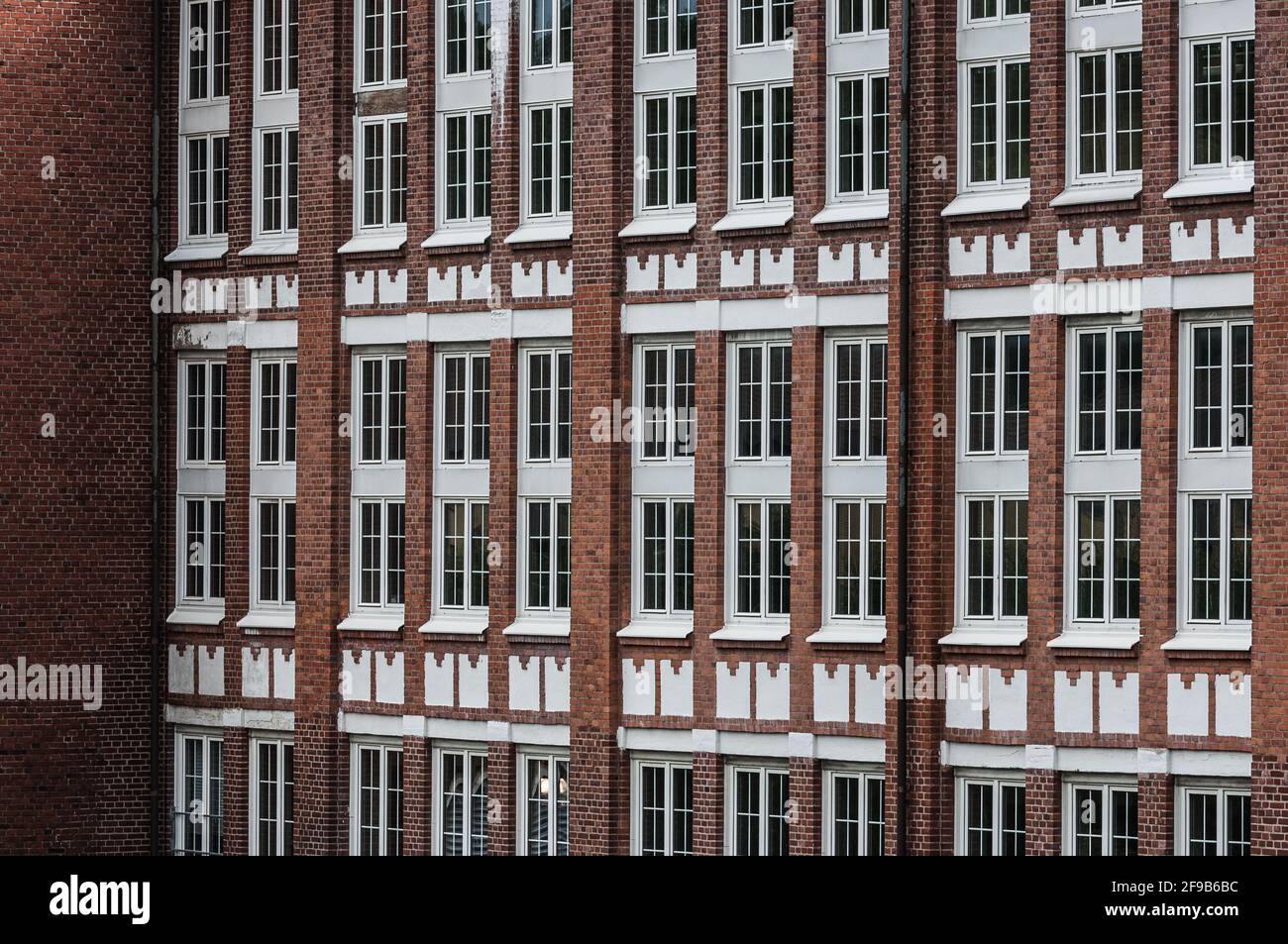 Windows on brick wall facade Stock Photo - Alamy