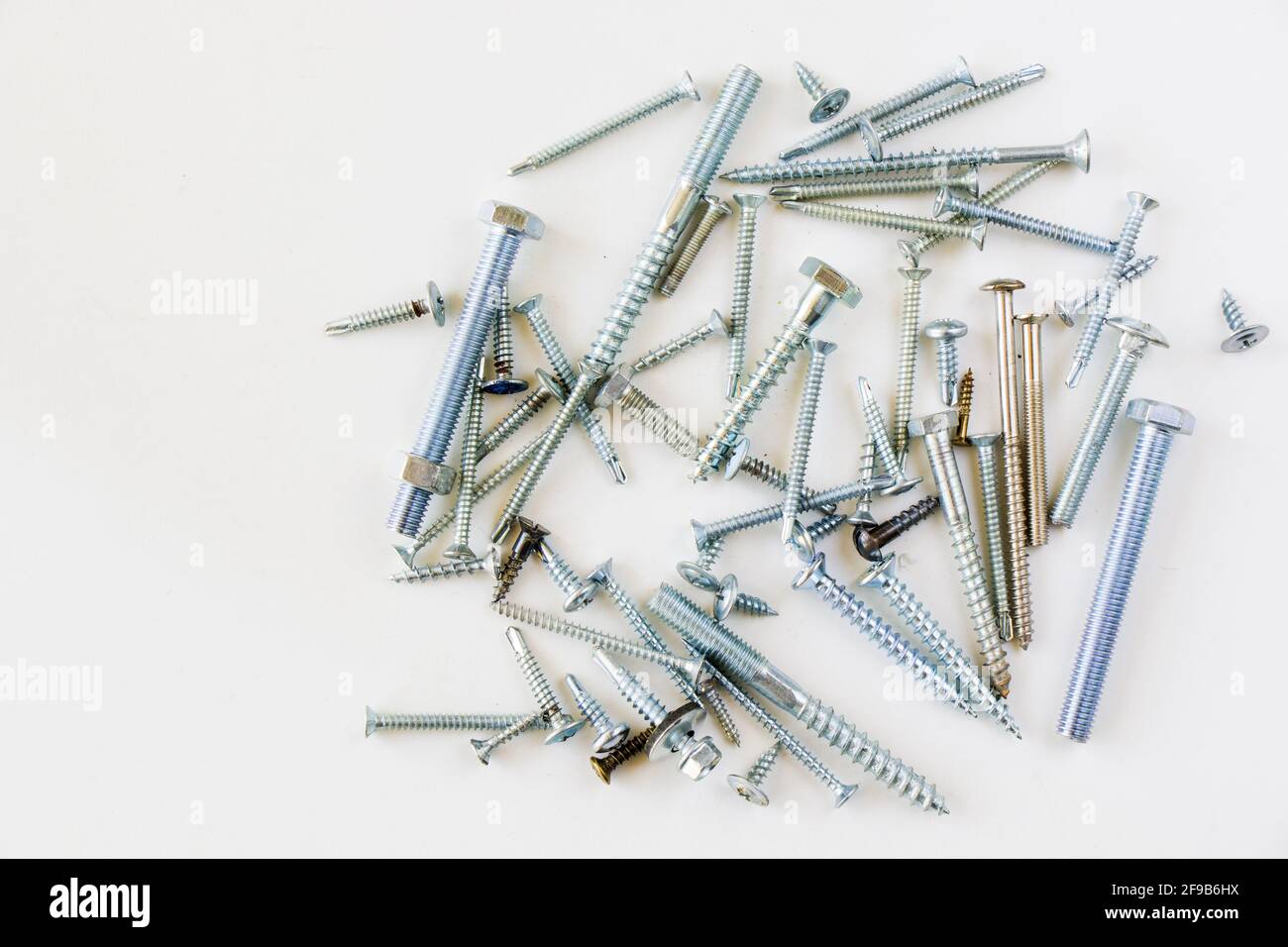 Bunch of different screws and bolts isolated onwhite background Stock ...