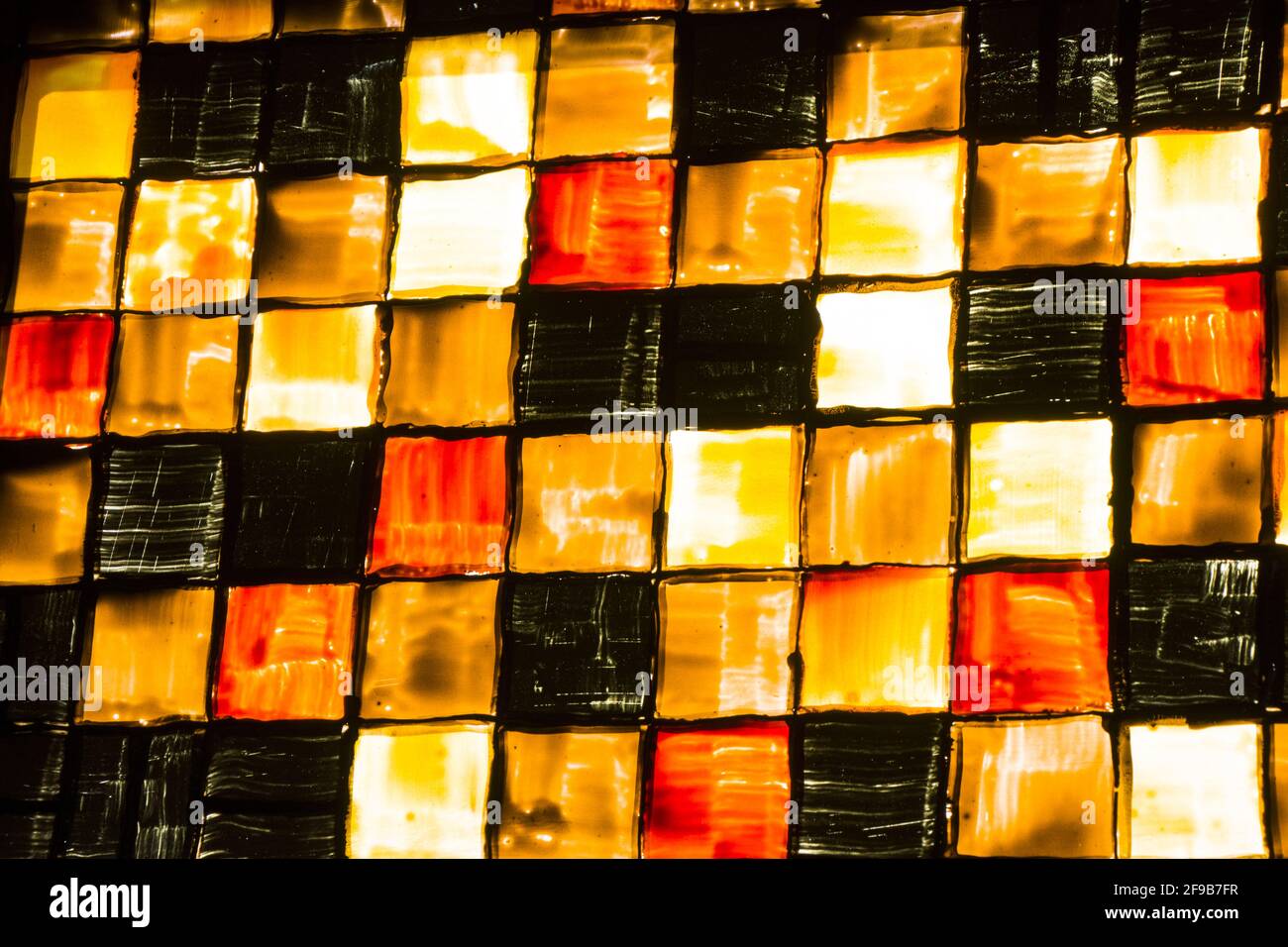 Abstract background design with orange and black tiles Stock Photo - Alamy