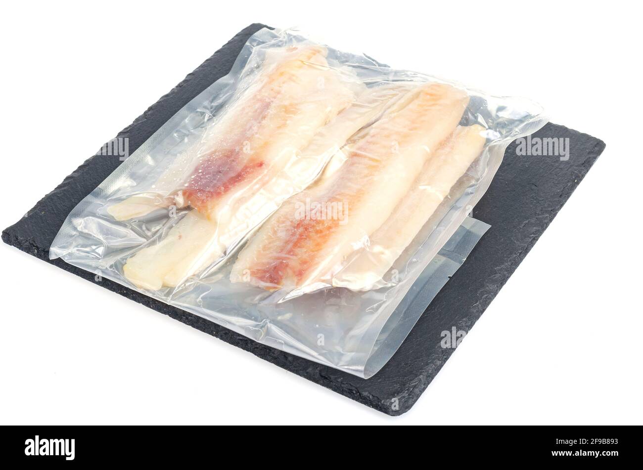 Packaging of frozen fillets of white fish, pollock. Studio Photo Stock ...