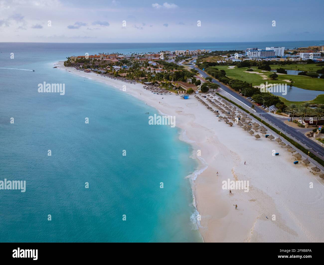 Aruba Caribbean white beach with palm trees and luxury swimming pool ...