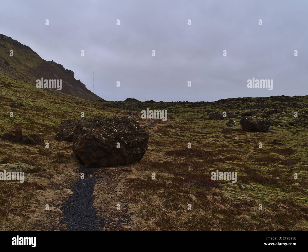 Big rock that fell down during an earthquake rests on hiking path at ...