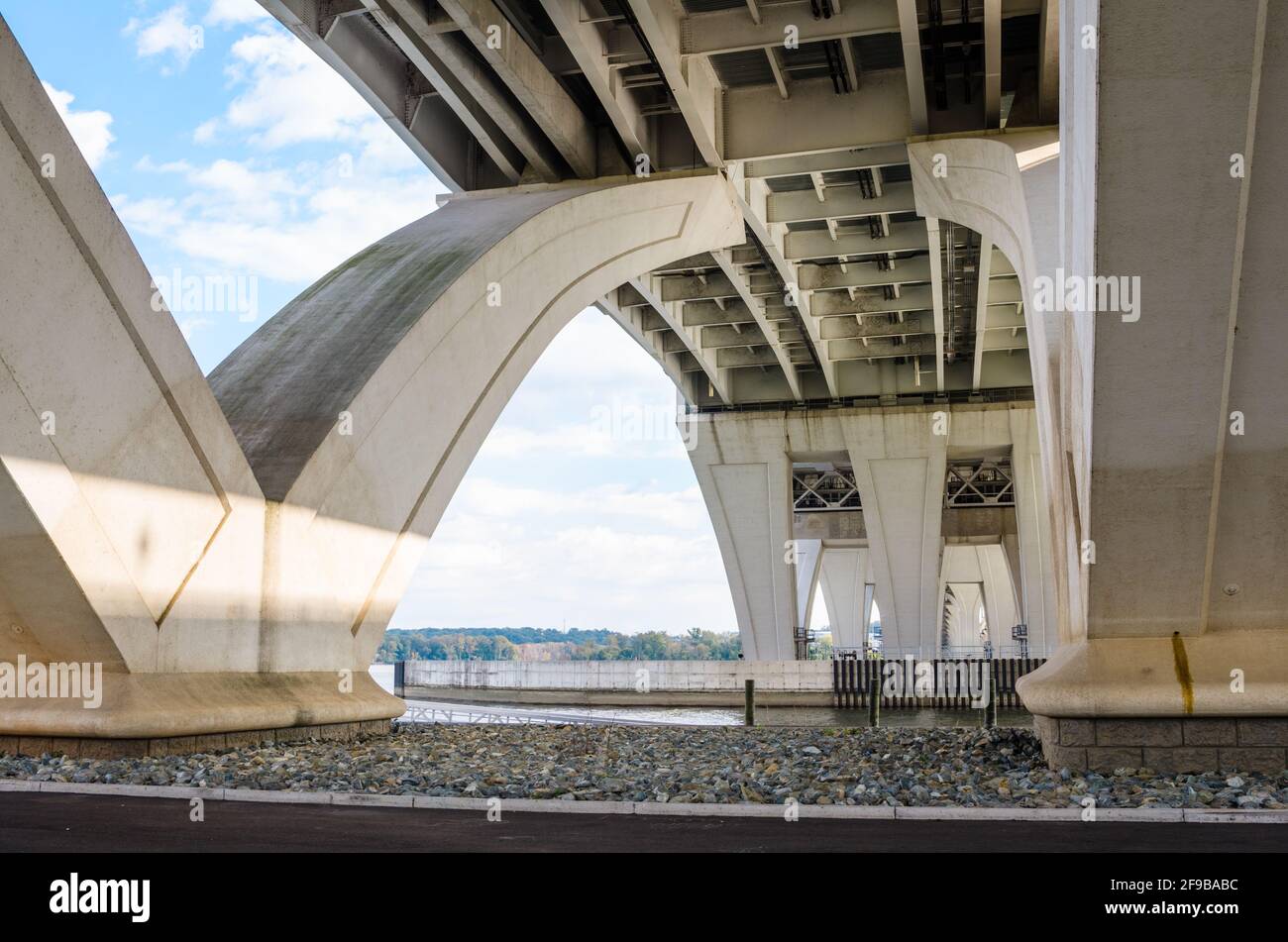 View from below of the underside structure of a large road bridge ...