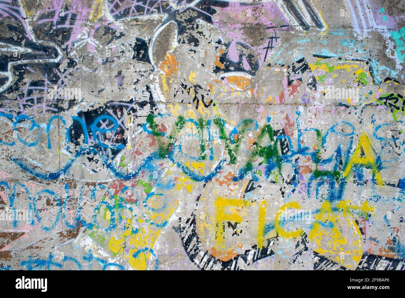 Old wall texture background, peeling cracked paint of different colors ...