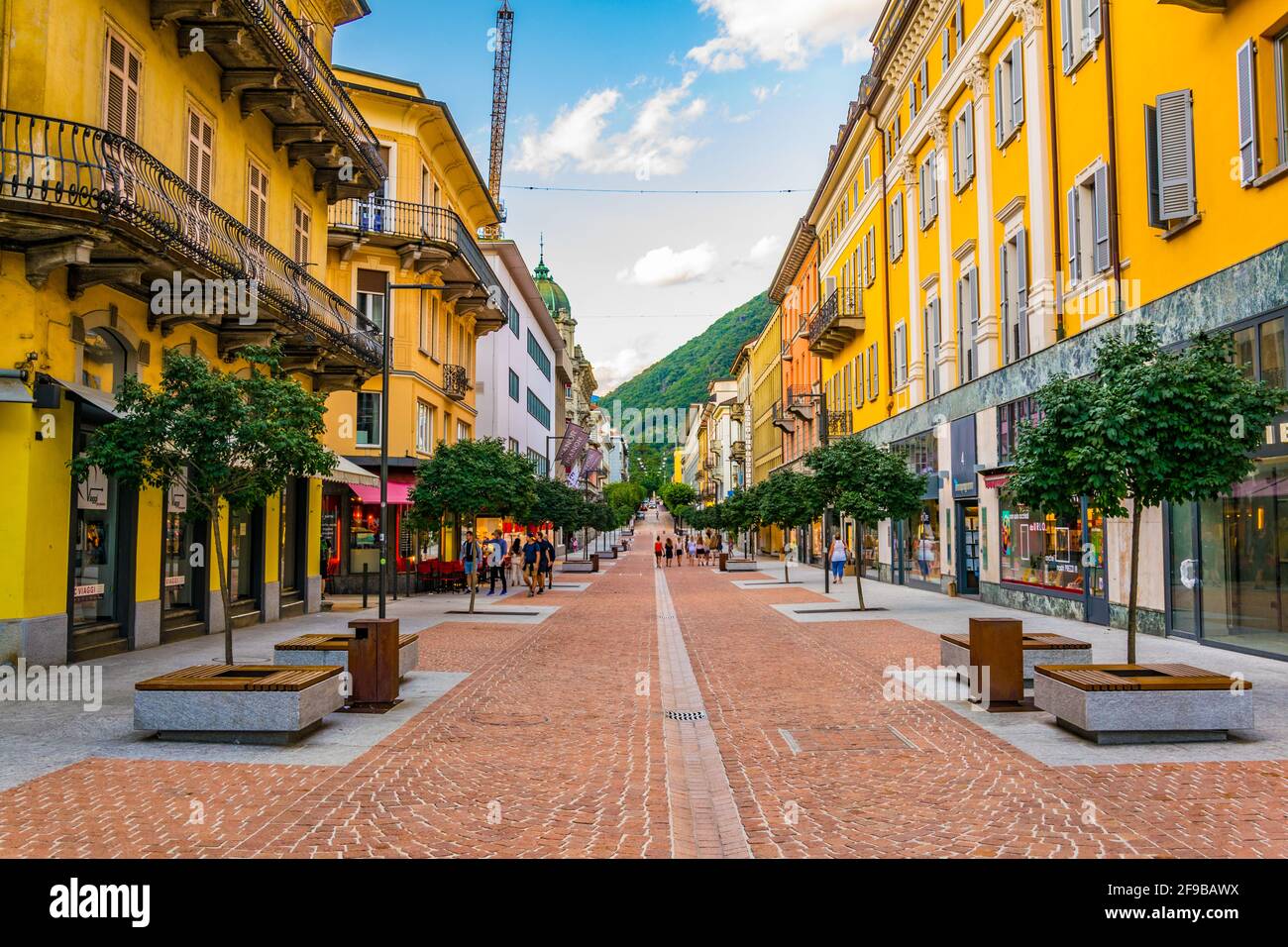 BELLINZONA, SWITZERLAND, JULY 26, 2017:Narrow street in the center of ...