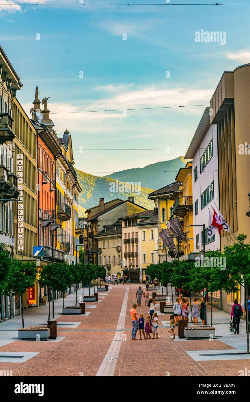 BELLINZONA, SWITZERLAND, JULY 26, 2017:Narrow street in the center of ...