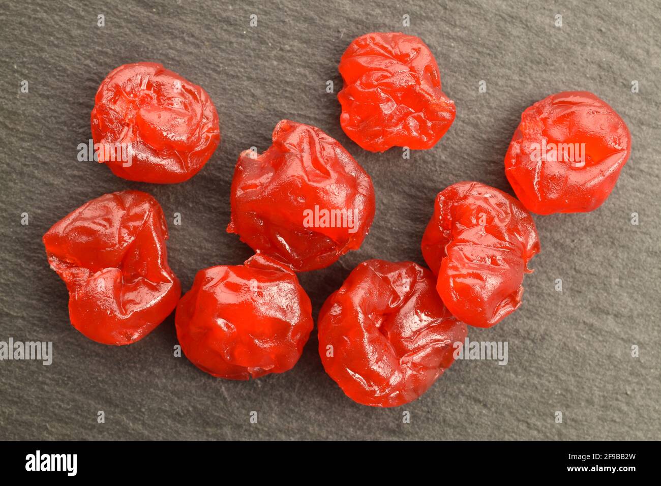 Several bright red, natural, organic, sweet and sour, dried cherries ...