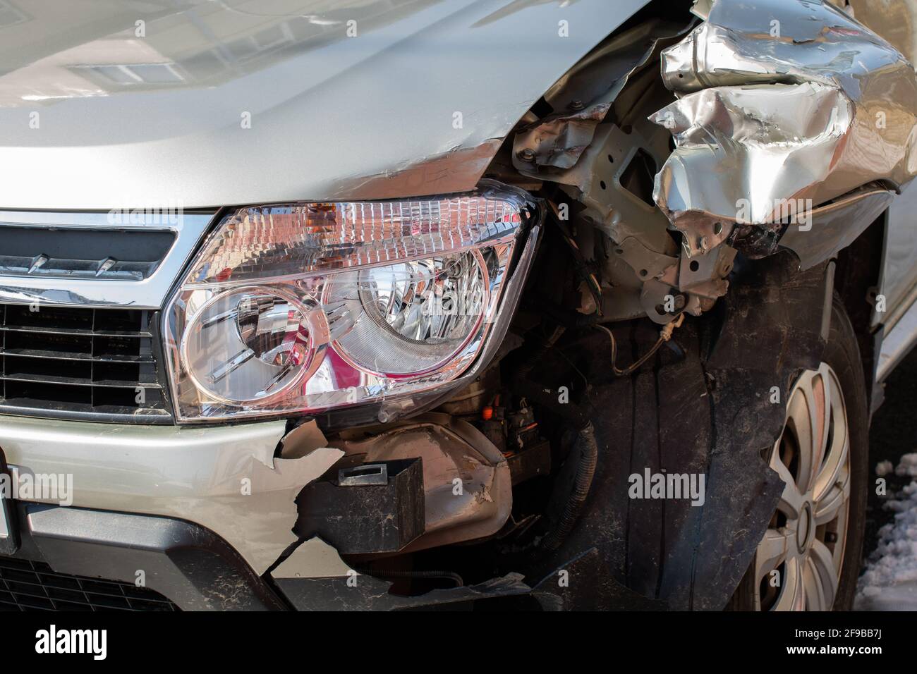 Damaged car detail of a Crushed metal and plastic after a traffic ...