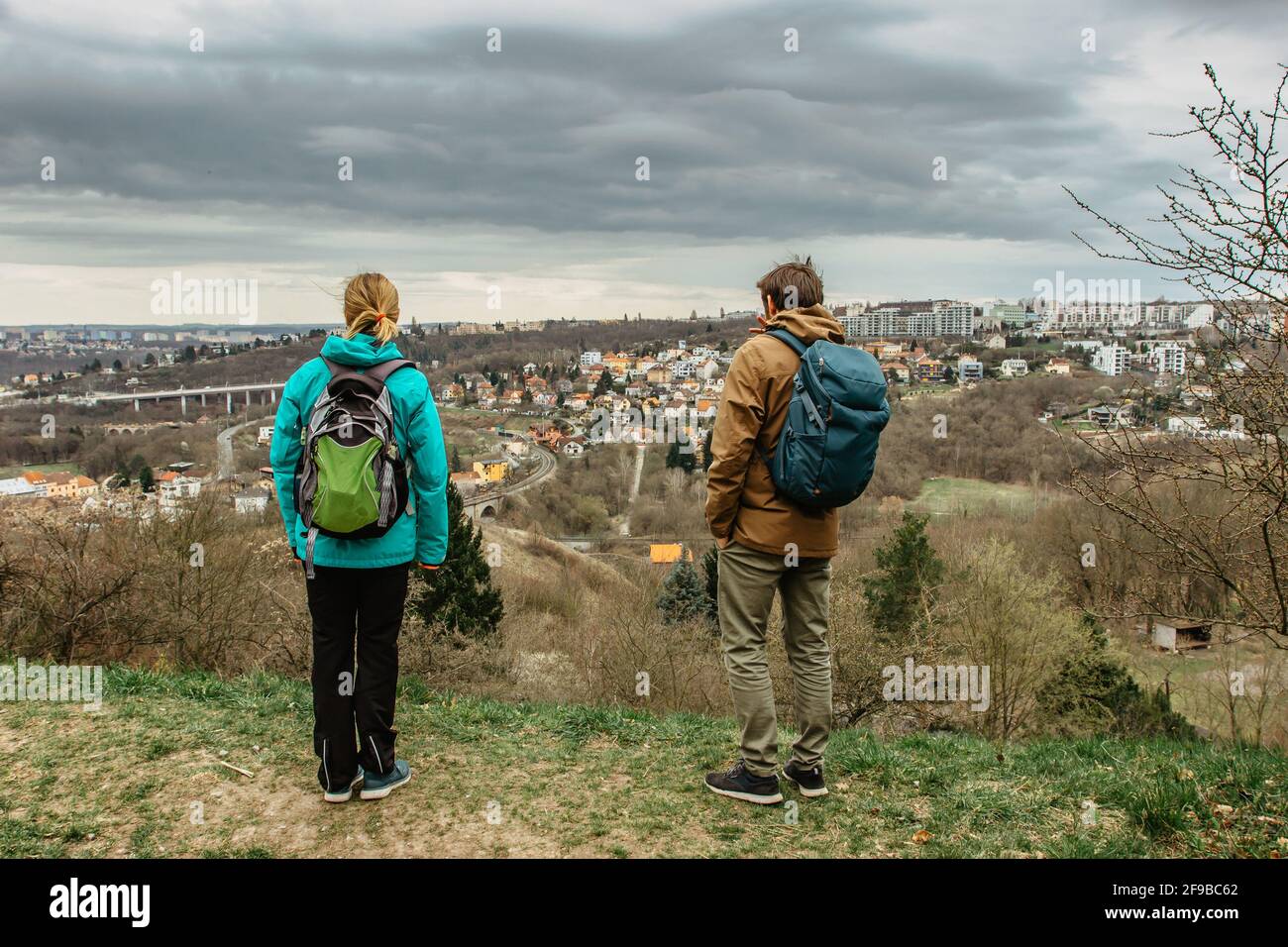 Two young backpackers enjoying view of Prague city skyline and Prokop ...