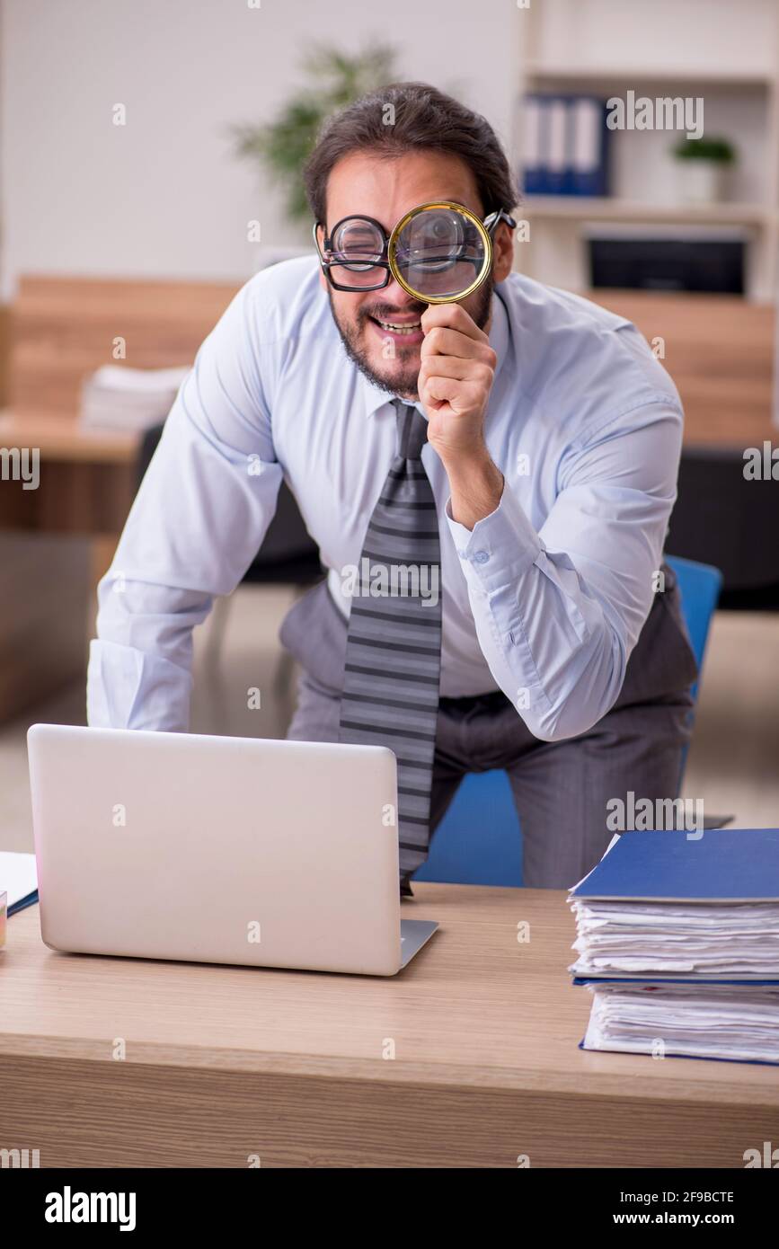 Office work funny young magnifying hi-res stock photography and images ...