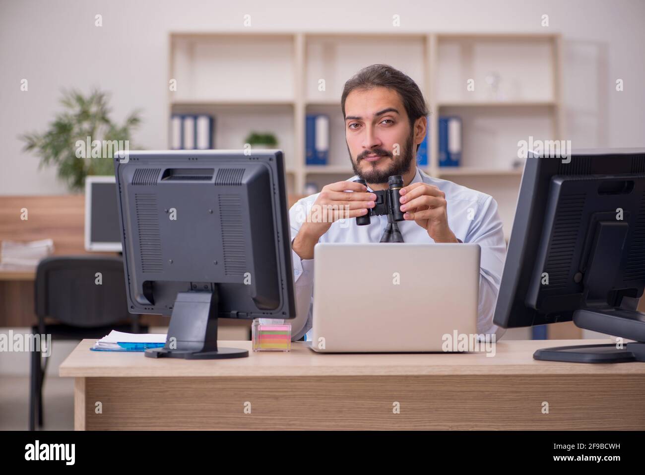 Multitasking young businessman inside office hi-res stock photography ...