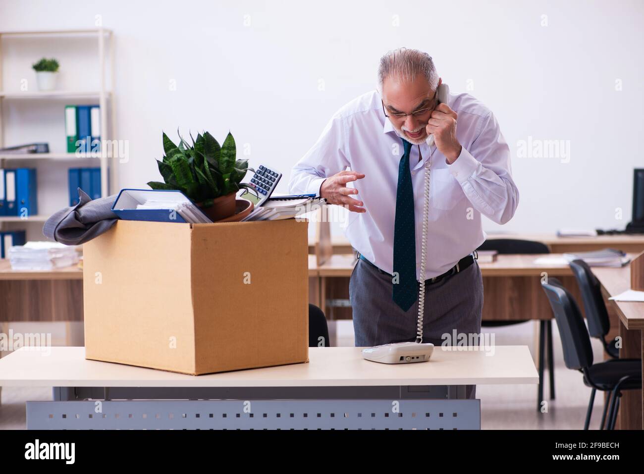 Old employee being fired from his work Stock Photo - Alamy