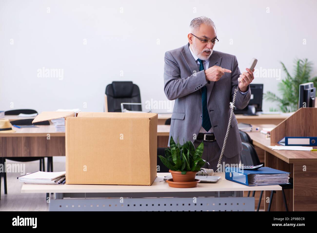 Old employee being fired from his work Stock Photo - Alamy