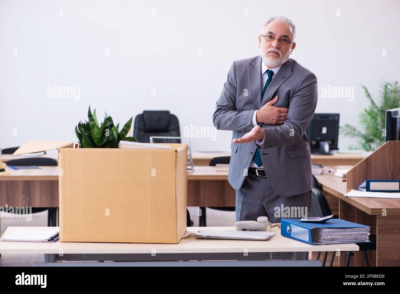 Old employee being fired from his work Stock Photo - Alamy