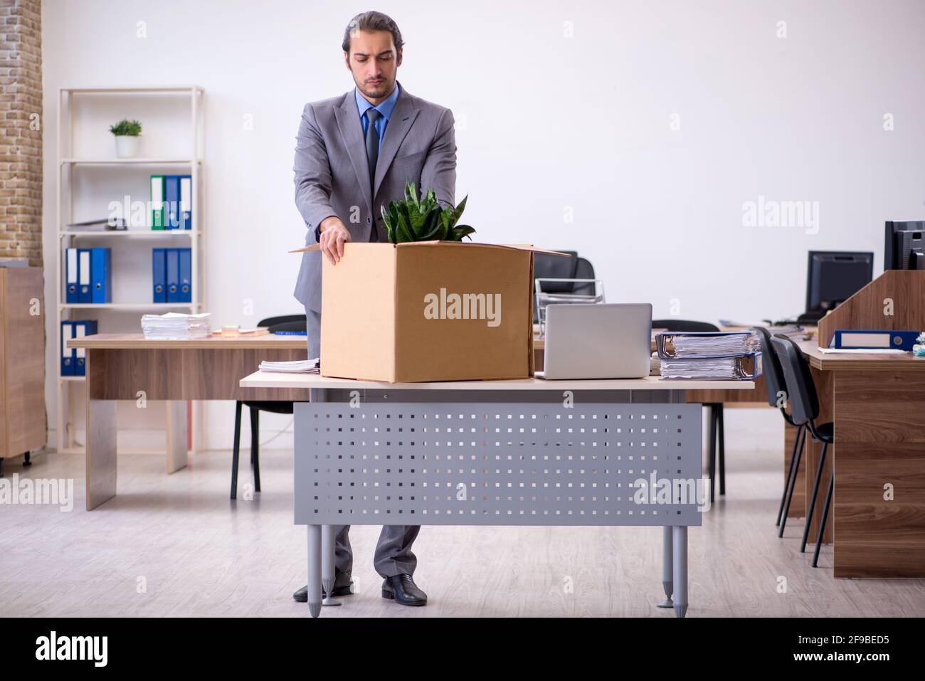 Young employee being fired from his work Stock Photo - Alamy