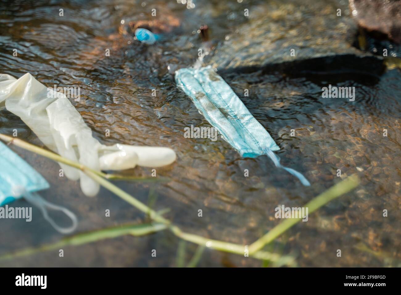 Top view of disposed medical wastes like masks, gloves and syringe ...