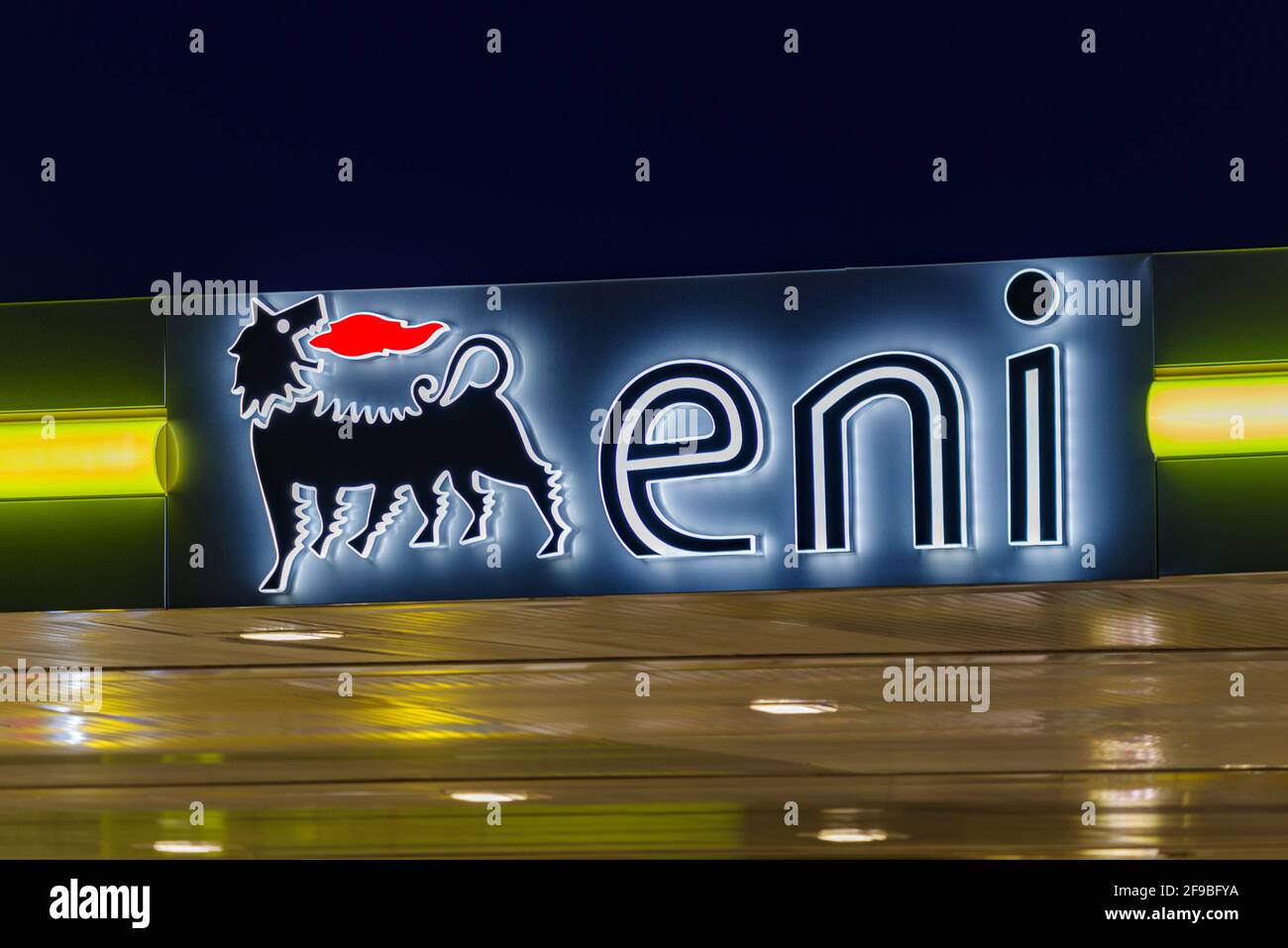 ENI SpA logo is illuminated on the company's service station in Imperia ...