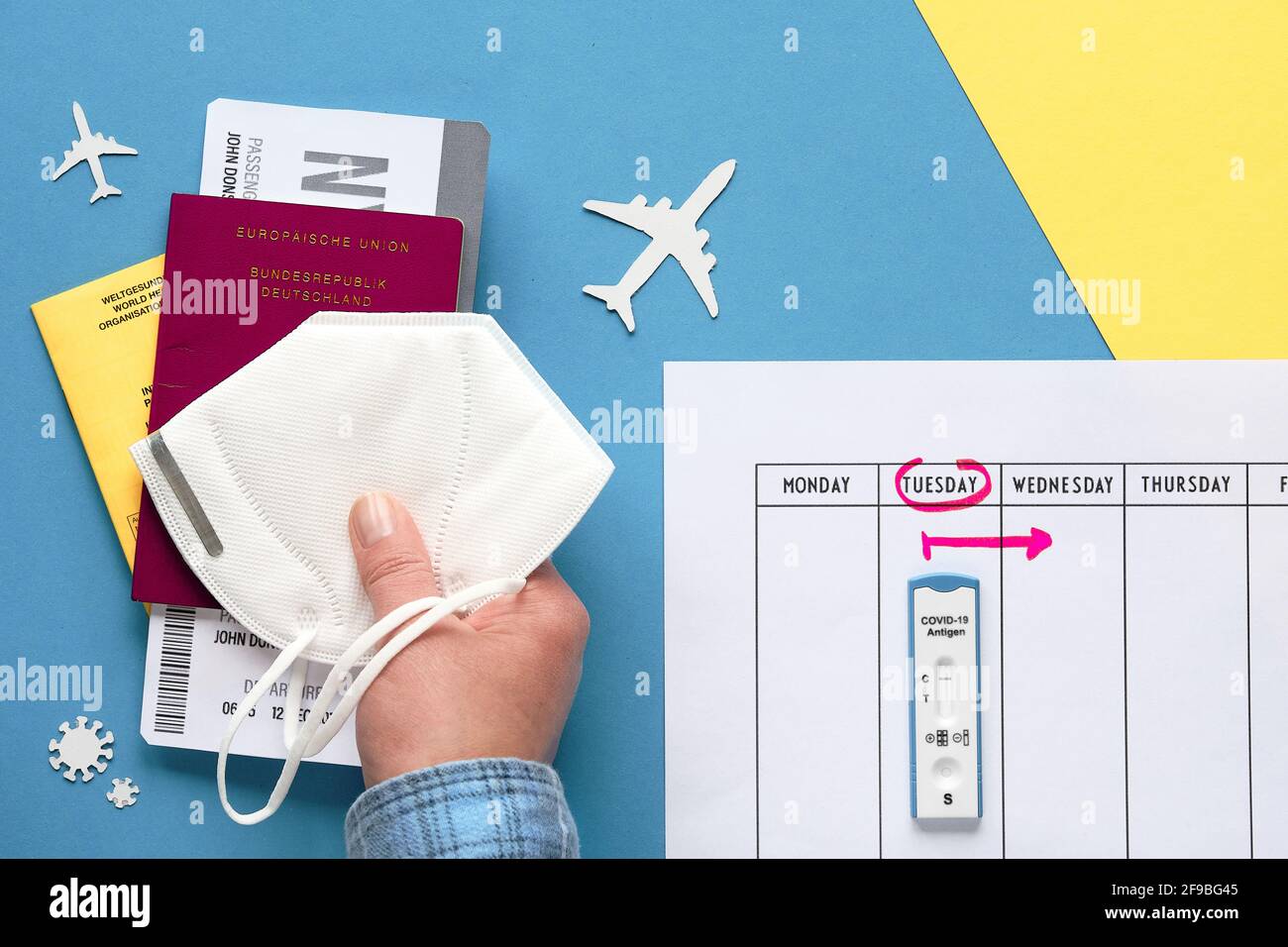 New normal travel during COVID-19 restrictions. Hand with pack of ...