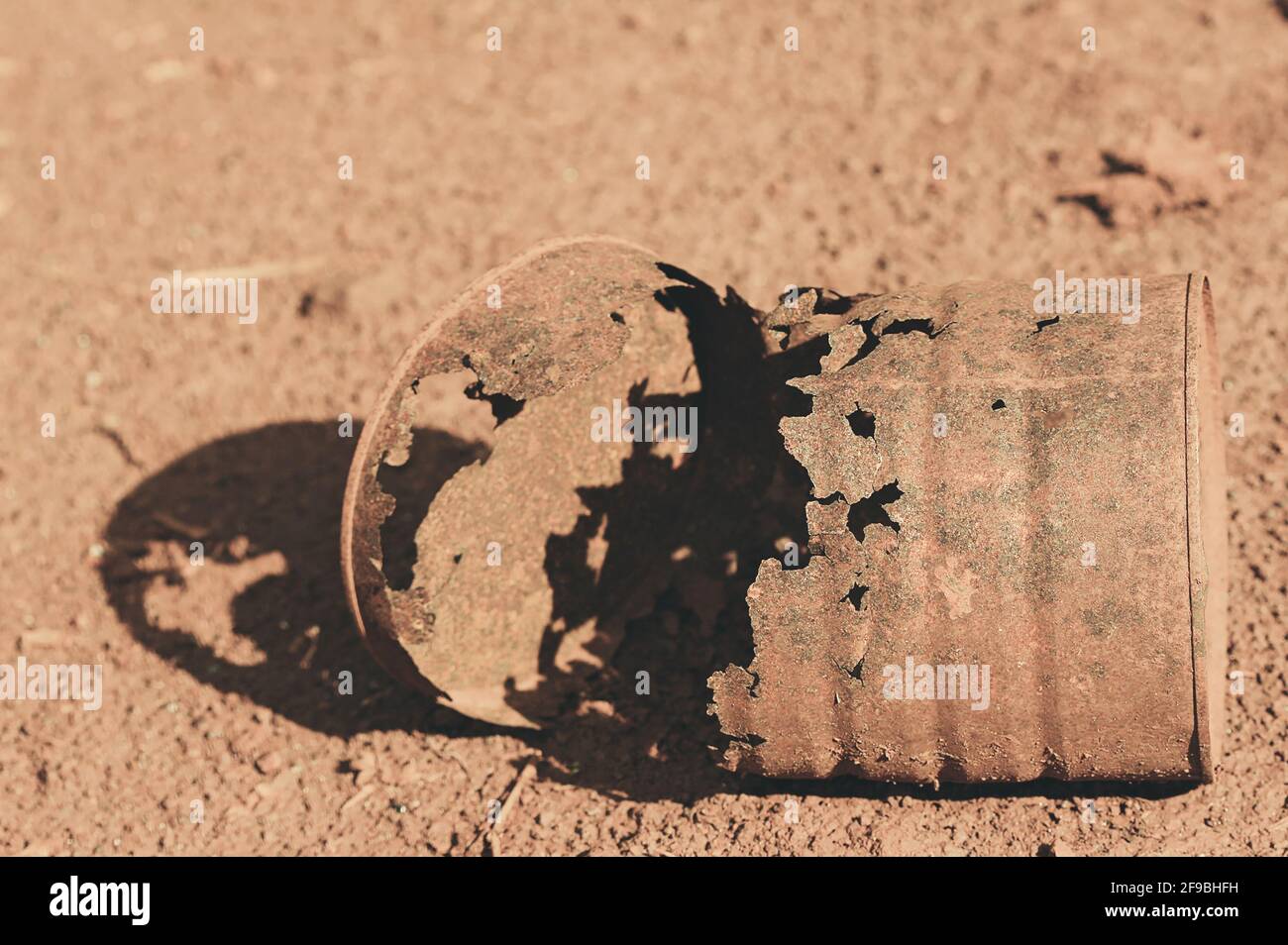 rusty can on the ground Stock Photo - Alamy