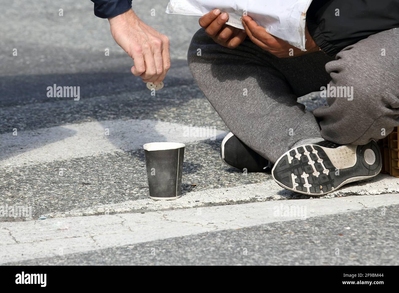 Man gives alms hi-res stock photography and images - Alamy