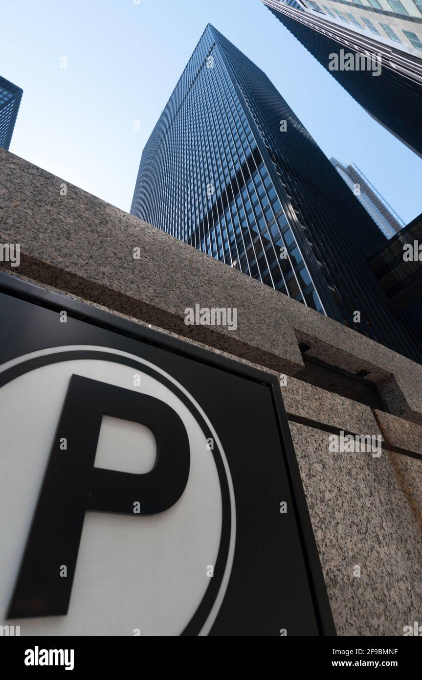 parking sign on a granite wall in the financial district of downtown ...